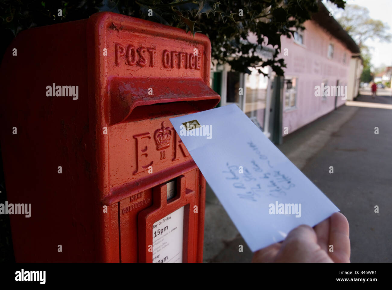 post letter Royal Mail monopoly postal service post box red Stock Photo ...