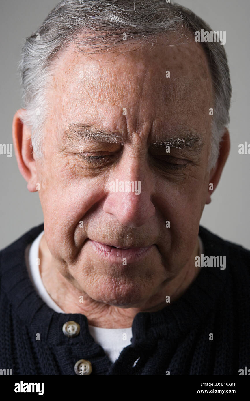 Man looking down shadow face close up hi-res stock photography and ...