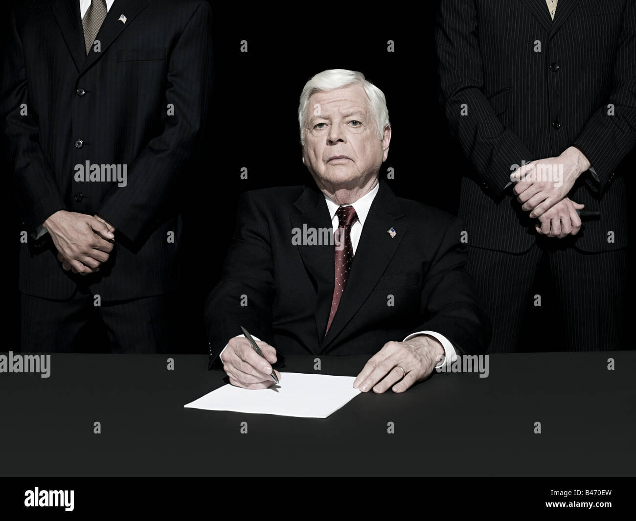 Politician signing paper Stock Photo - Alamy