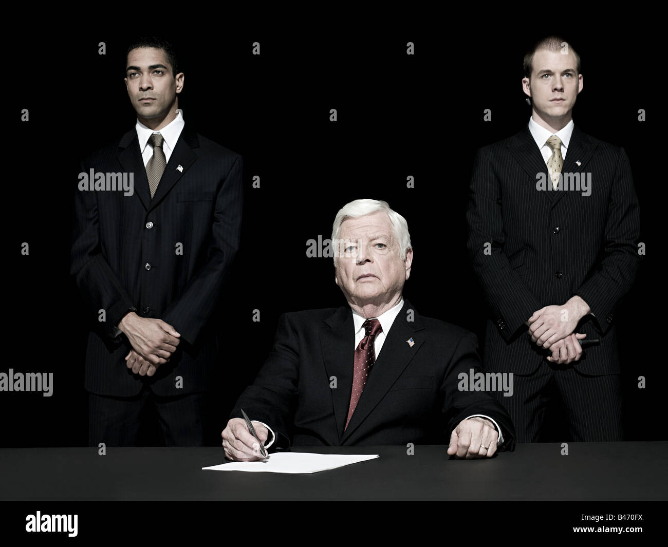 Politician signing paper Stock Photo - Alamy