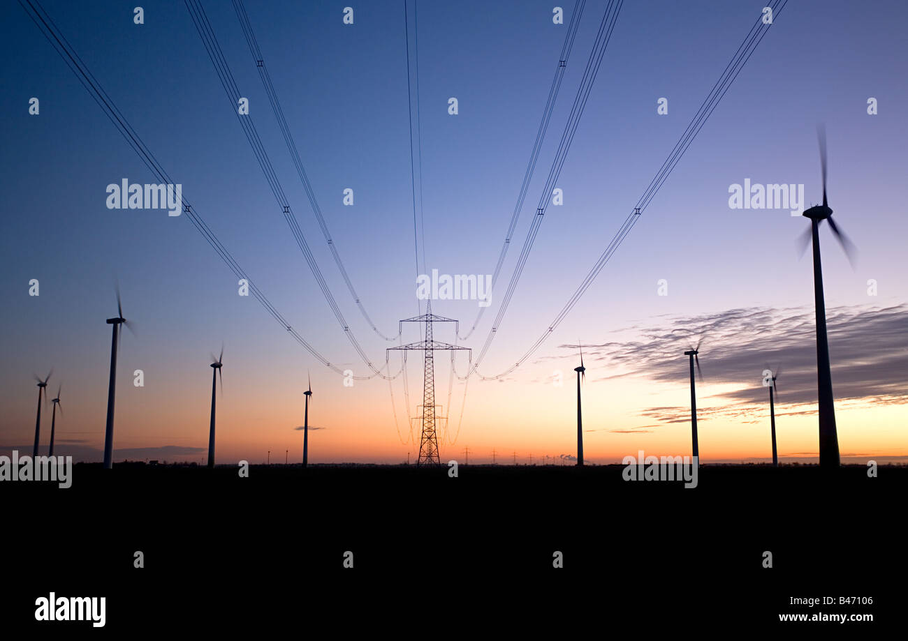 Pylon and wind turbines Stock Photo - Alamy
