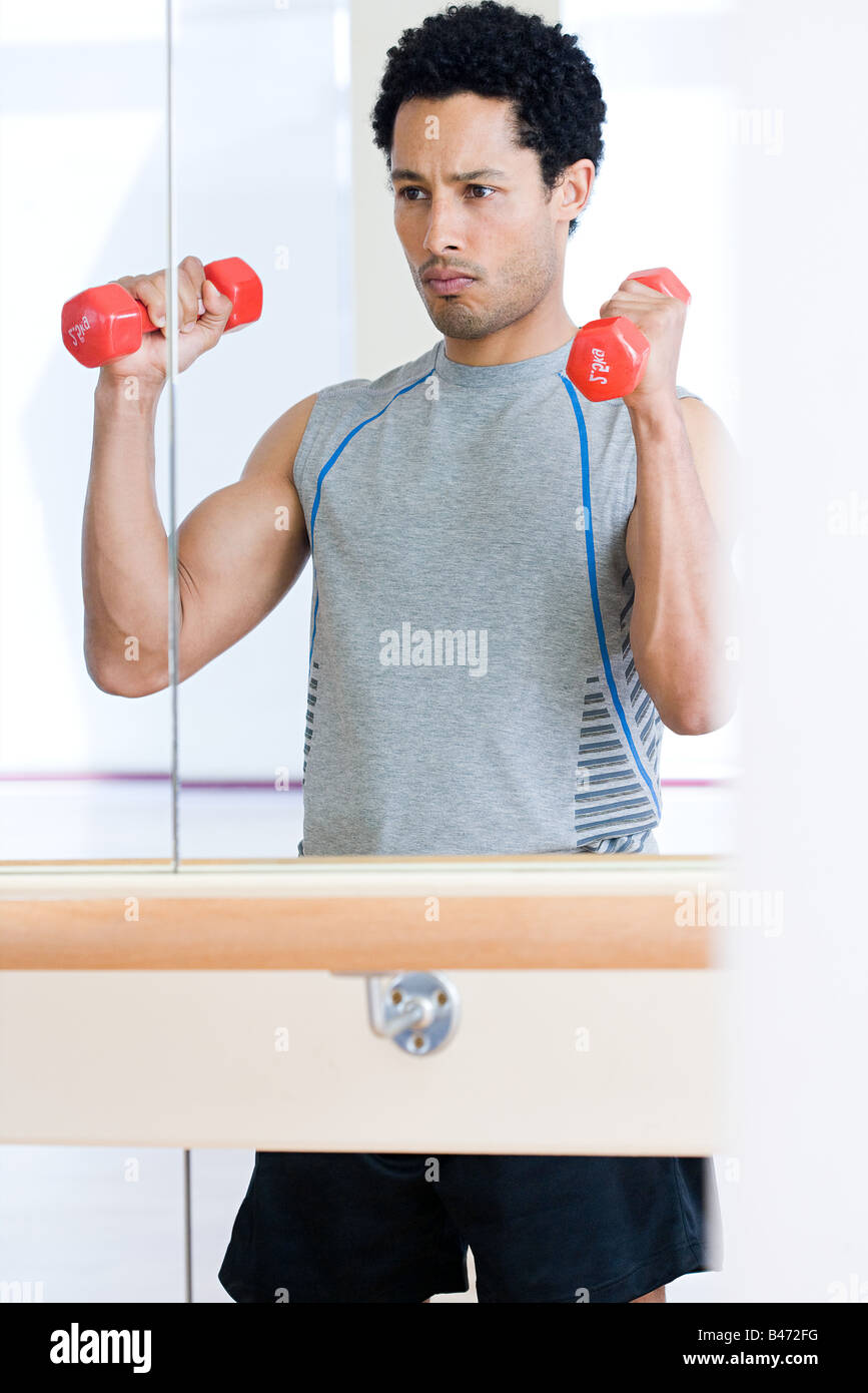 Man with dumbbells Stock Photo - Alamy
