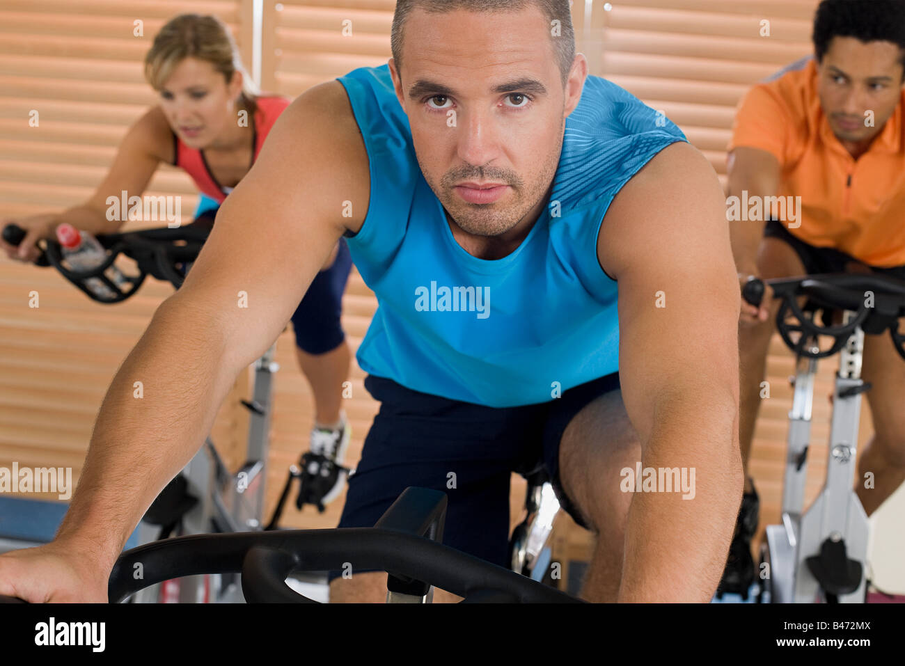 People on exercise bikes Stock Photo - Alamy
