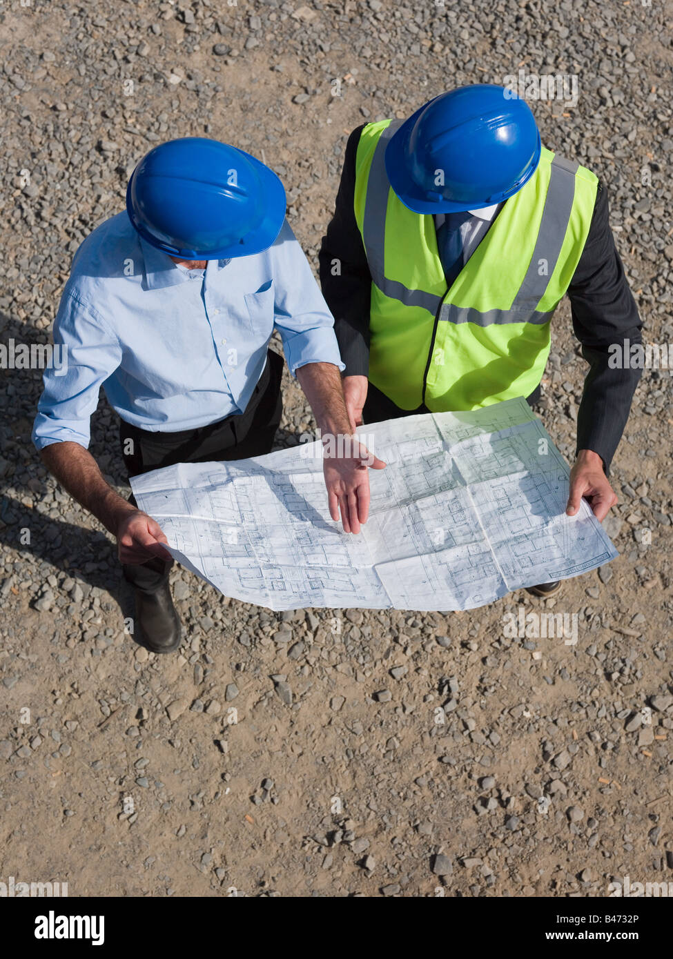 Men with blueprint Stock Photo - Alamy