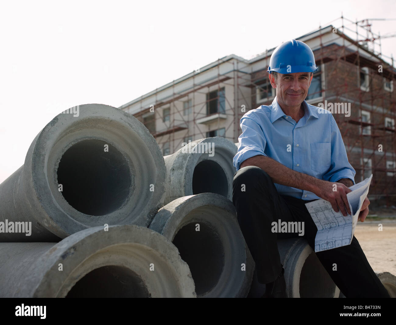 Architect on building site Stock Photo - Alamy