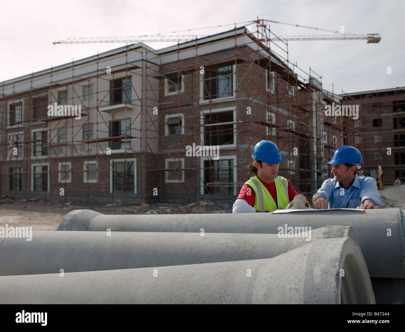Engineers on building site Stock Photo - Alamy