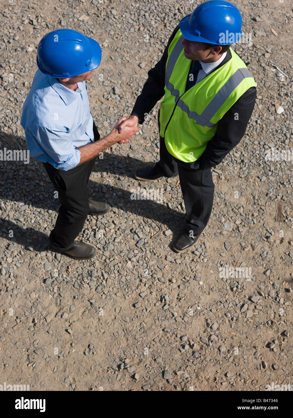 Engineers shaking hands Stock Photo - Alamy