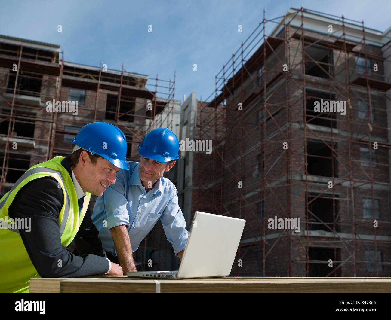 Two engineers looking at computer hi-res stock photography and images ...