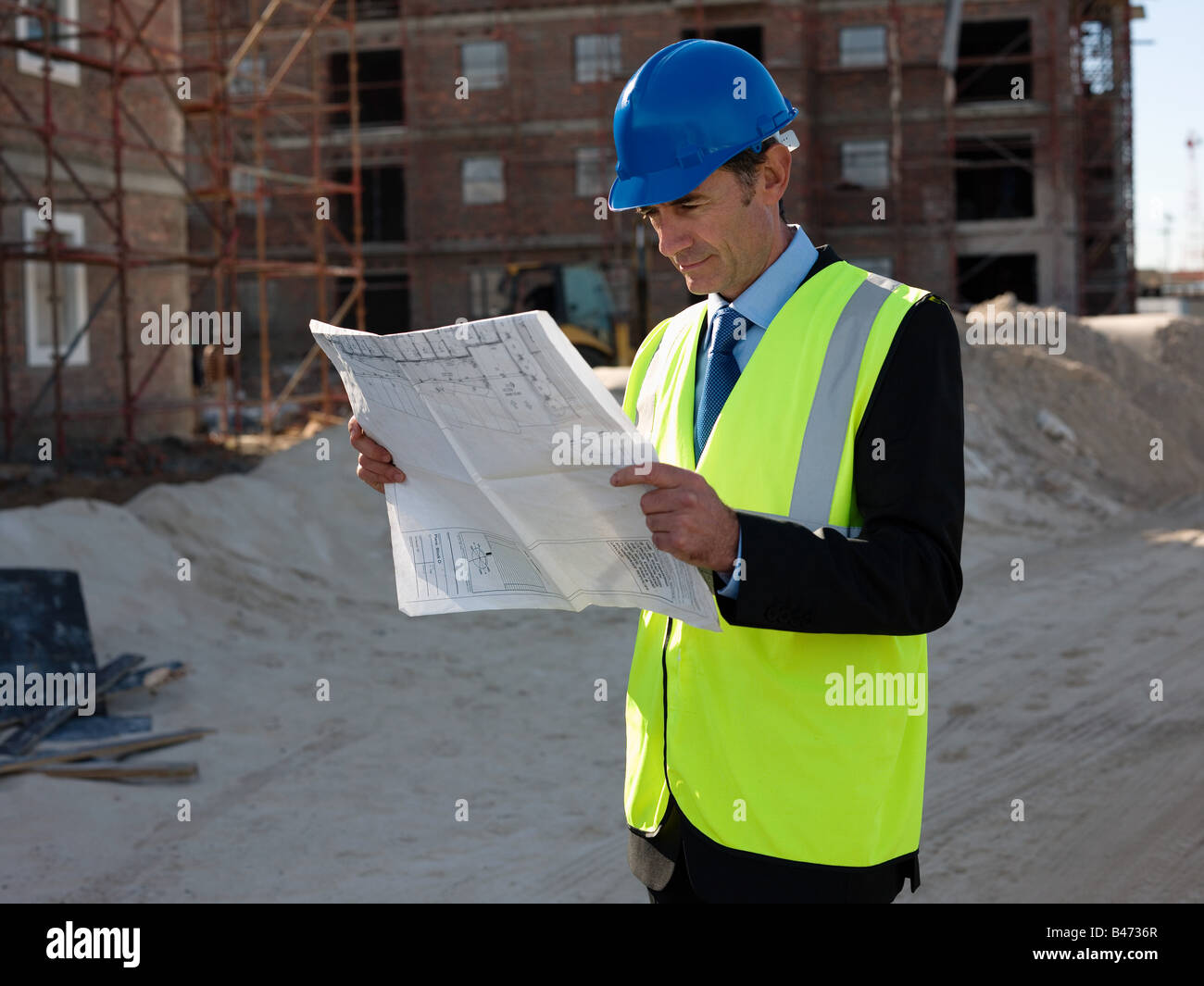 Architect on building site Stock Photo - Alamy