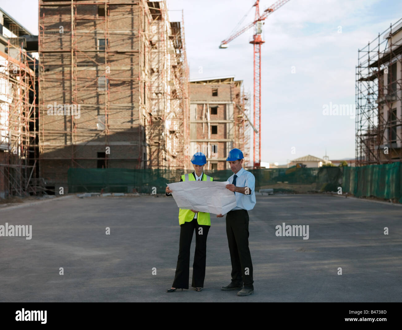 Architects on building site Stock Photo - Alamy