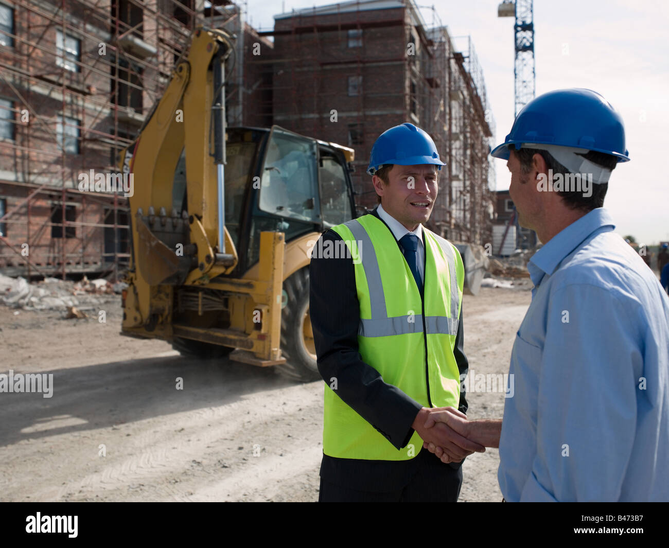 Engineers shaking hands Stock Photo - Alamy