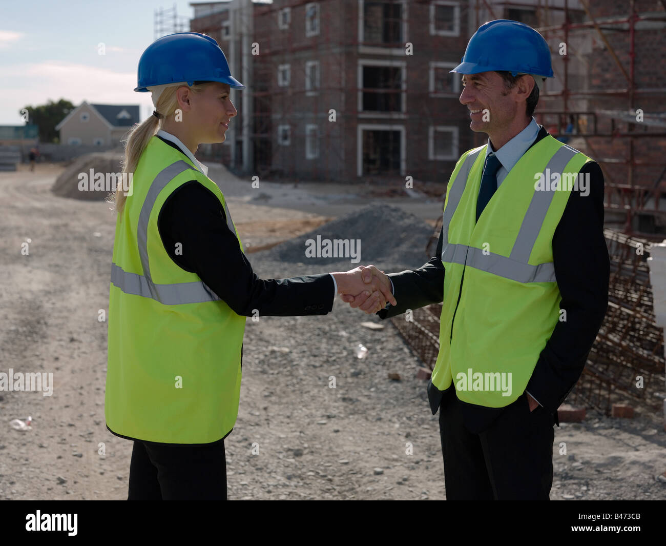 Engineers shaking hands Stock Photo - Alamy