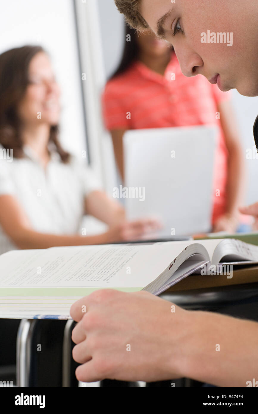 A male high school student reading Stock Photo - Alamy