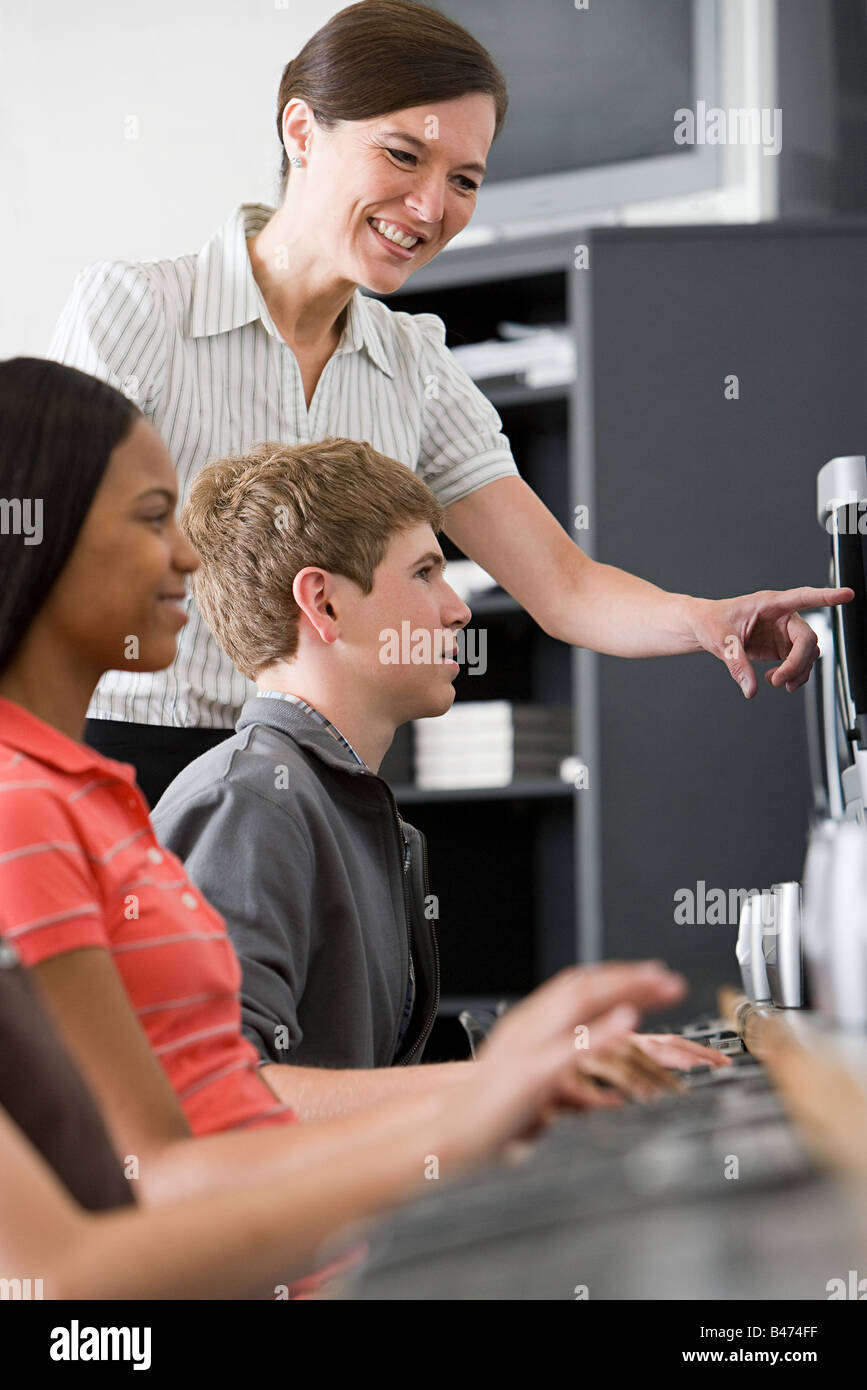 A teacher helping a student Stock Photo - Alamy