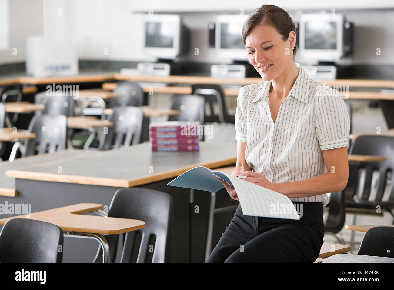 Teacher marking female hi-res stock photography and images - Alamy