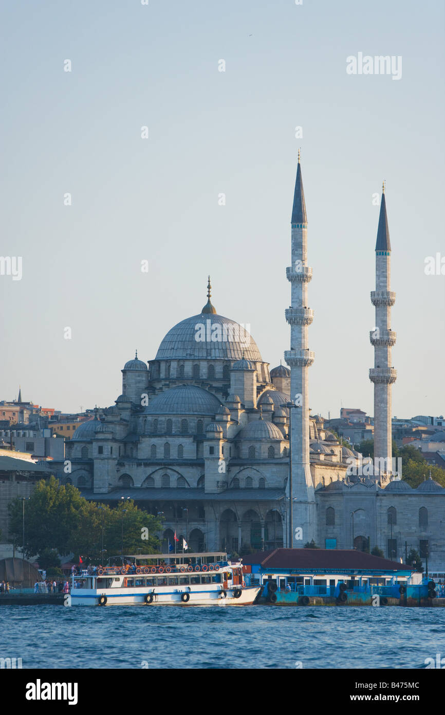 Boat on golden horn and yeni mosque Stock Photo - Alamy