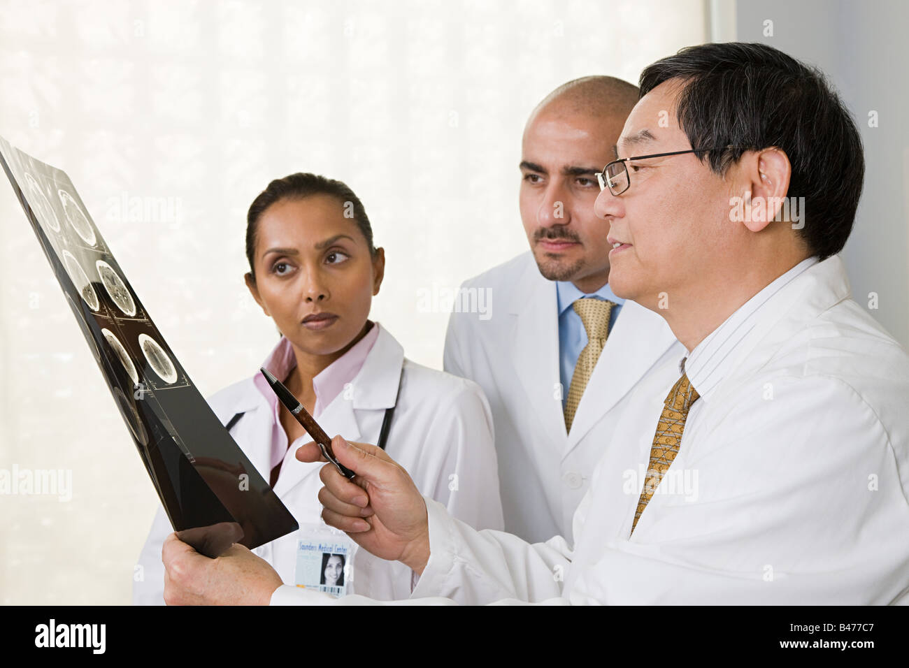 Doctors looking at an xray Stock Photo - Alamy