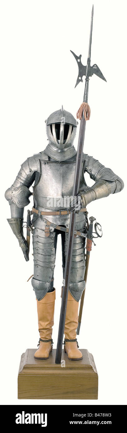 A cuirassier armour with dagger, sword, and halberd, an historical ...