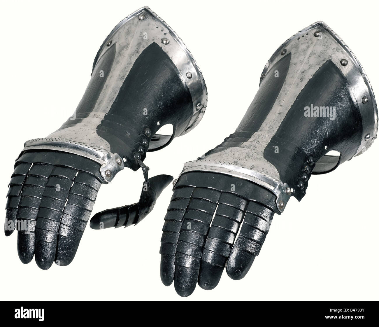 A pair of black and white gauntlets, German, circa 1570. Gauntlets with ...