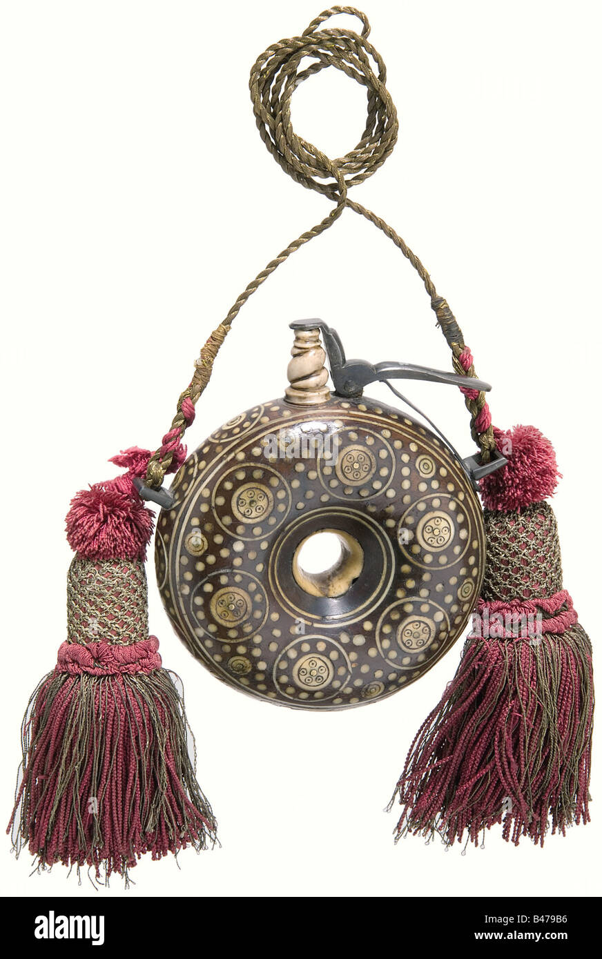 A priming flask, German, circa 1590. Ring shaped walnut body lavishly ...