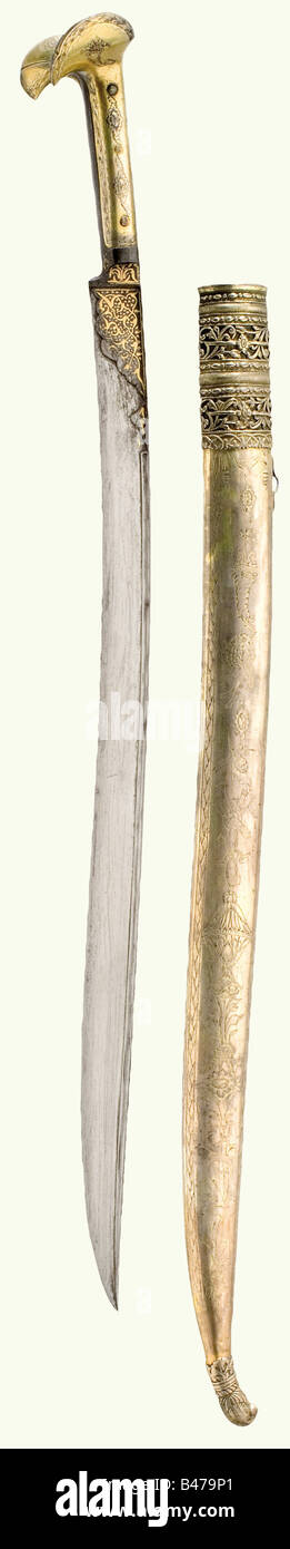 An Ottoman silver-mounted yatagan, circa 1780. Typically curved blade ...