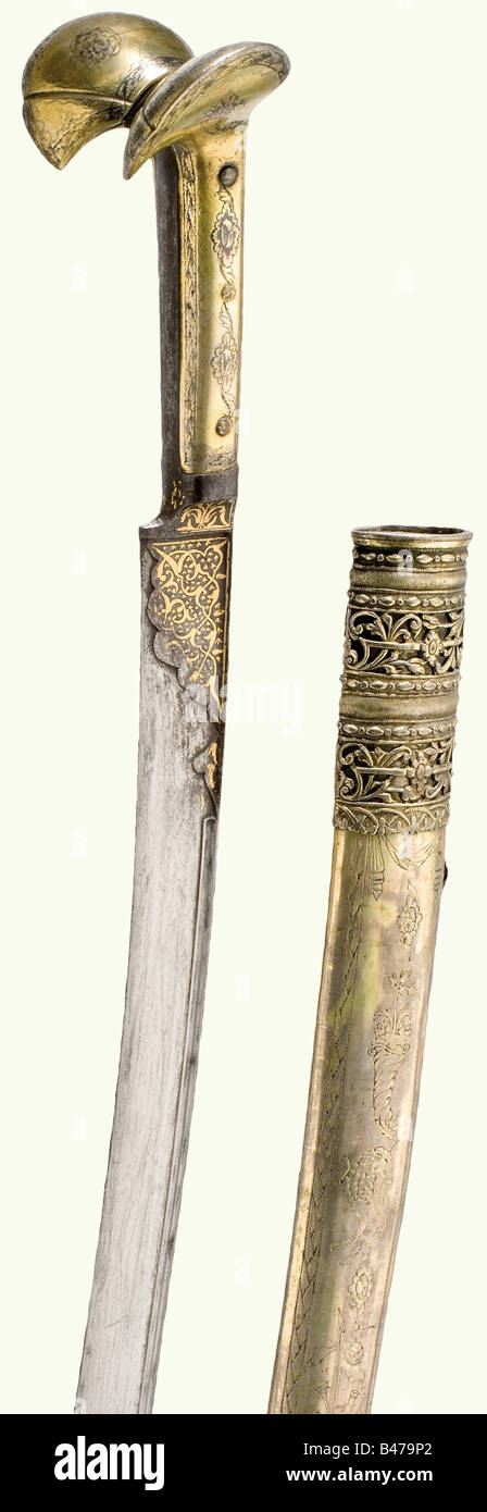 An Ottoman silver-mounted yatagan, circa 1780. Typically curved blade ...