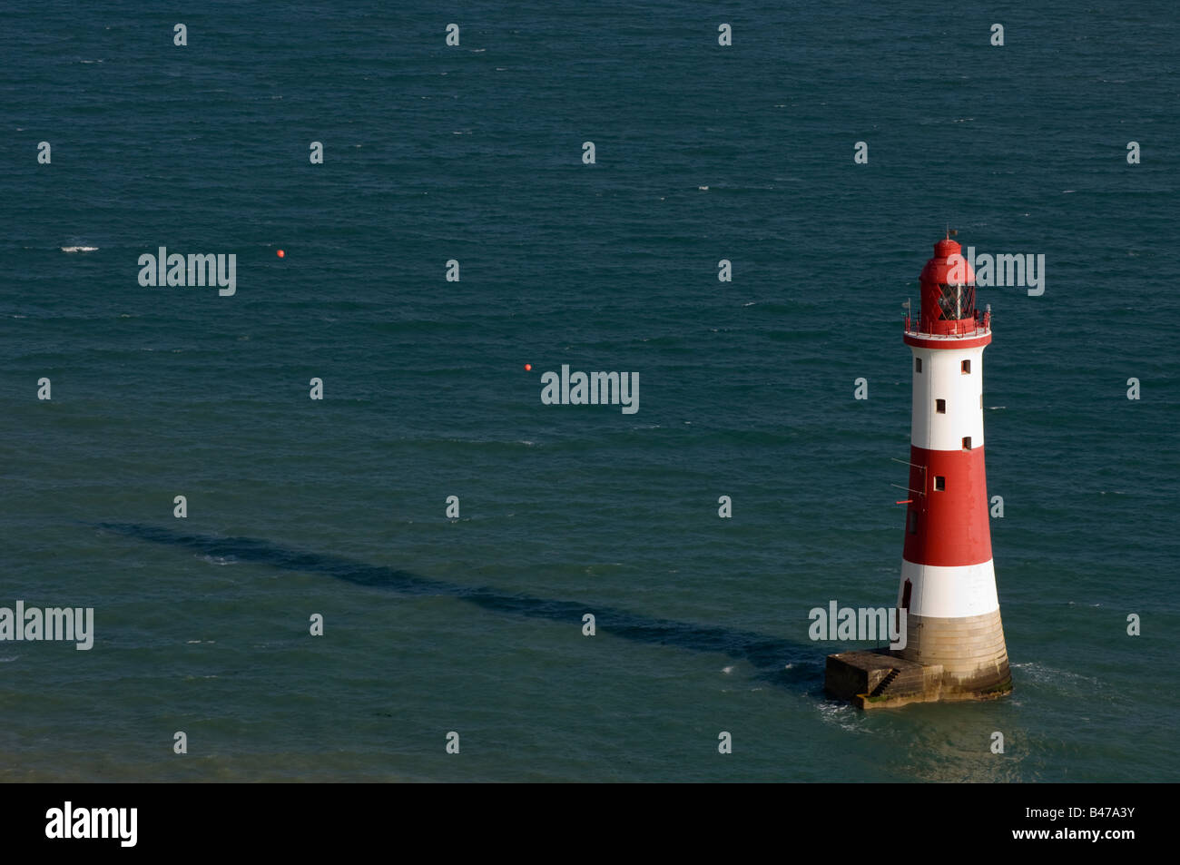 Beachy Head Lighthouse casts a shadow across the sea near the notorious ...