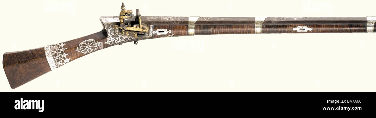 A miquelet flintlock rifle, decorated in silver, Ottoman, dated 1825 ...