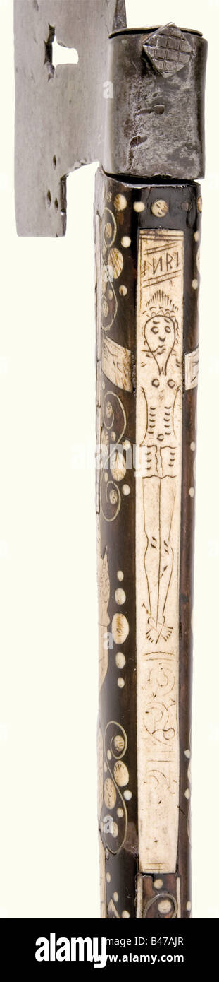 A miner's axe, Saxony, dated 1658 Jagged iron blade with cross and ...