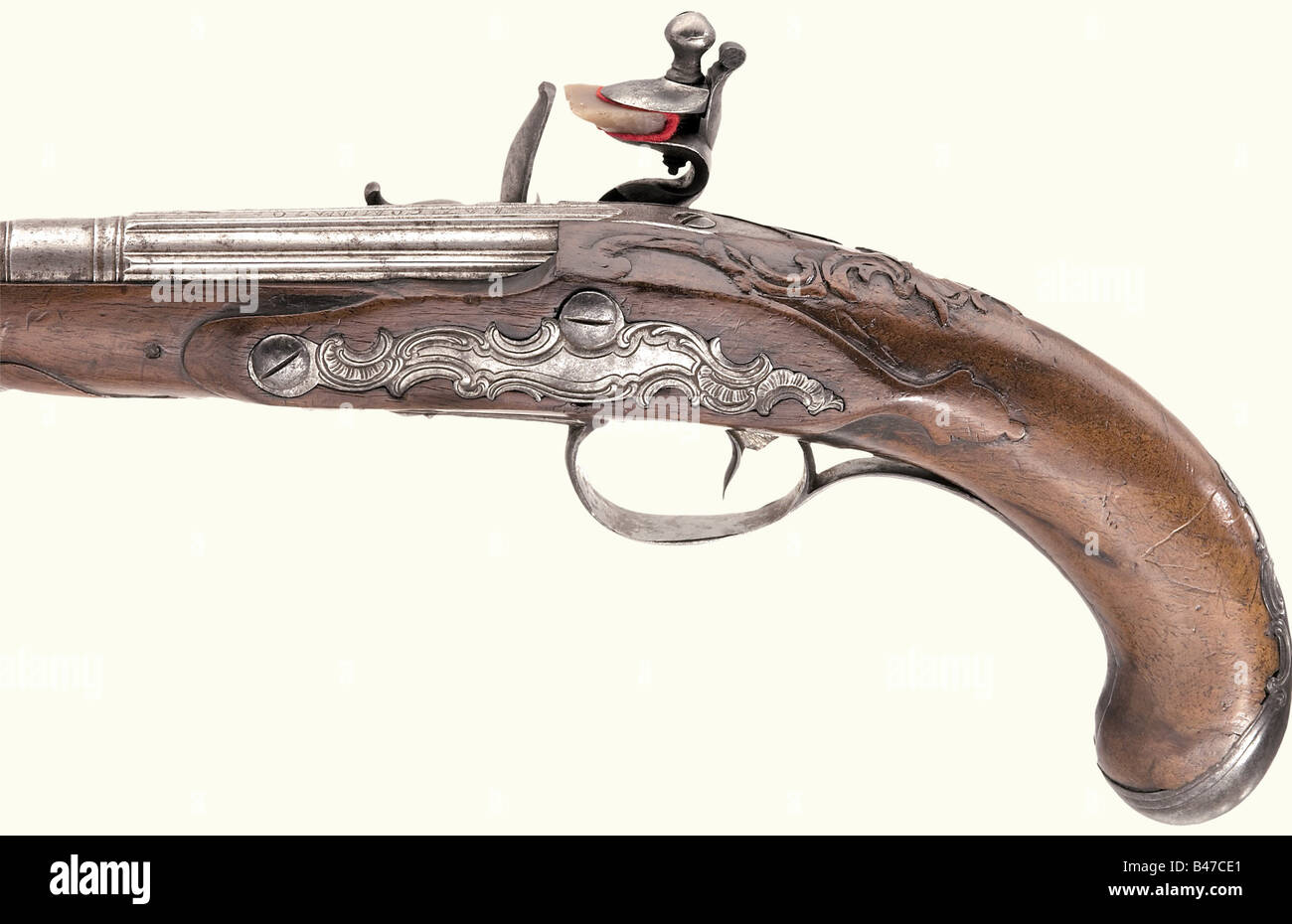 A pair of flintlock pistols, German (Suhl?), circa 1750. Old fluted barrels, merging to round ...