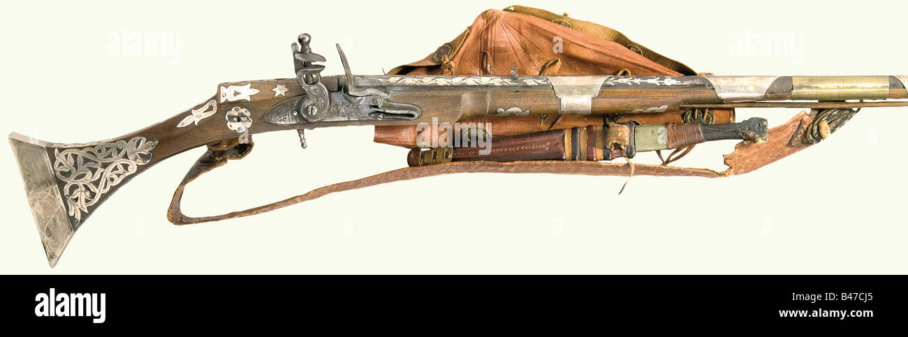 A flintlock musket, Algeria, dated 1842. Long barrel with smooth bore ...