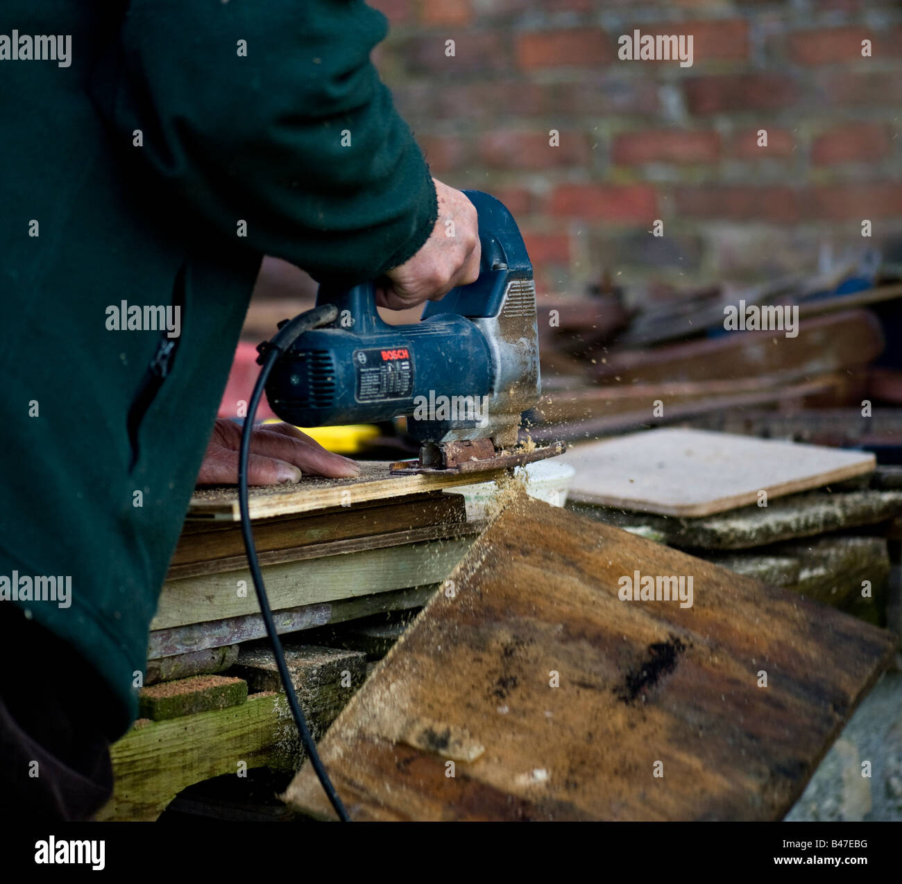 Man Using Jigsaw Powertool Stock Photo - Alamy