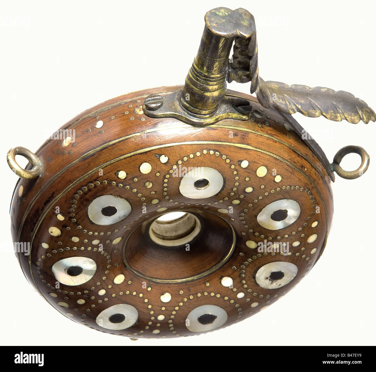 A German priming flask, circa 1600. Ring shaped fruitwood body richly ...