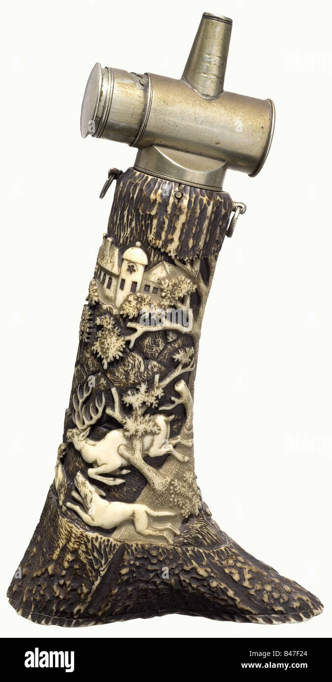 A carved German powder flask, 19th century. Made from a forked antler ...