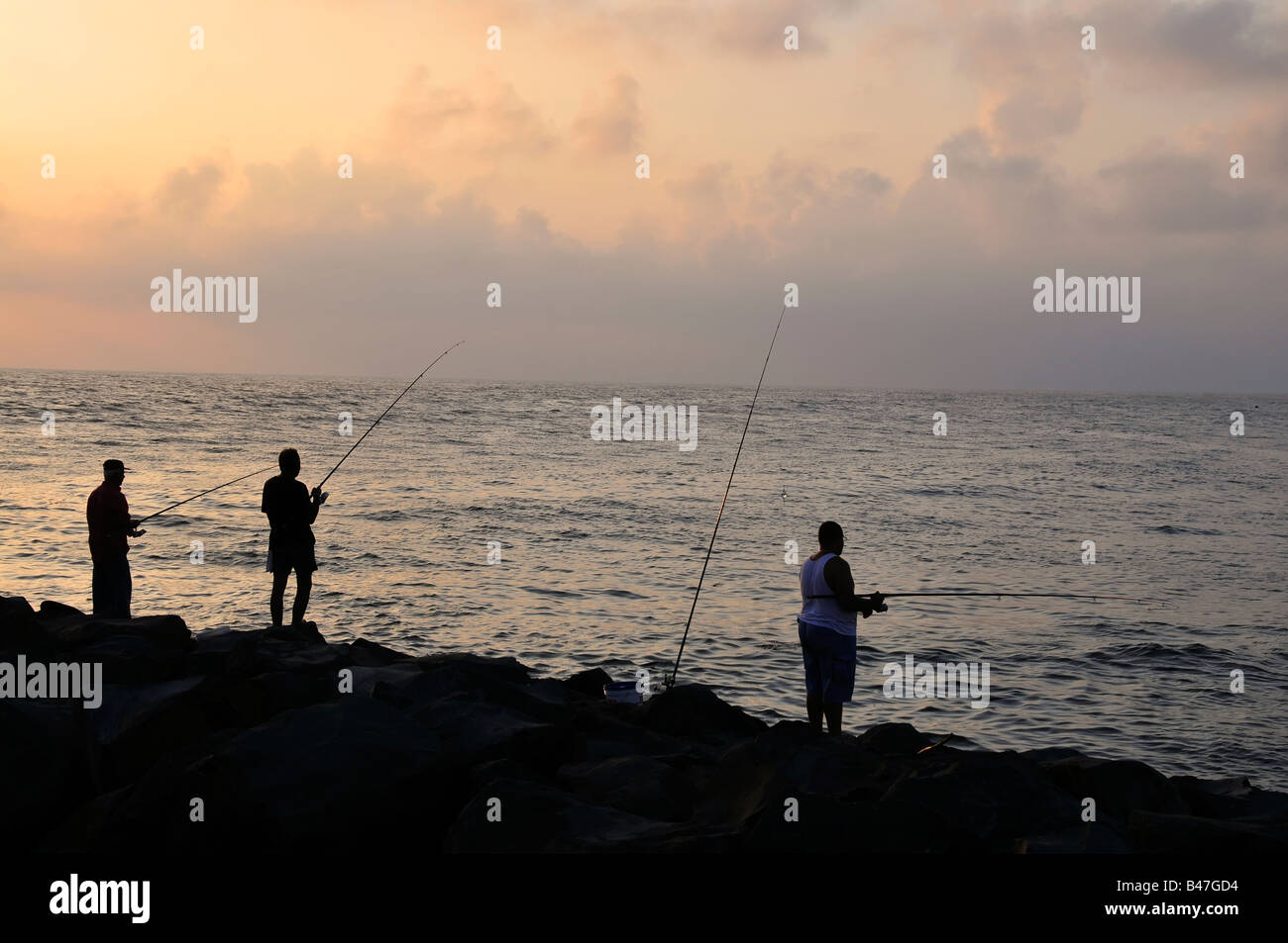 fishing on the sea at sunset Stock Photo - Alamy