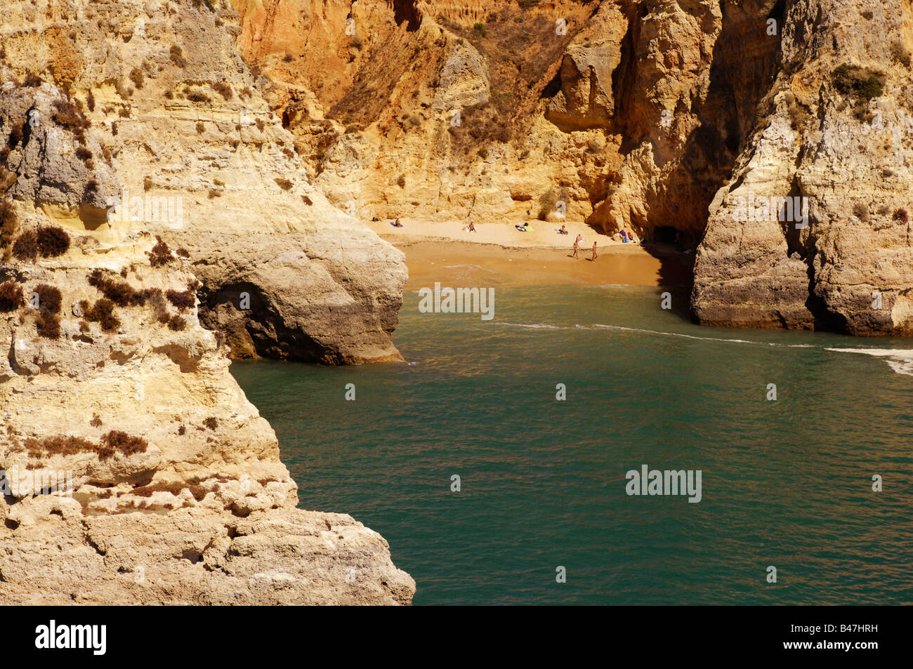 A small secluded beach under the cliffs on the coast near Praia Da ...