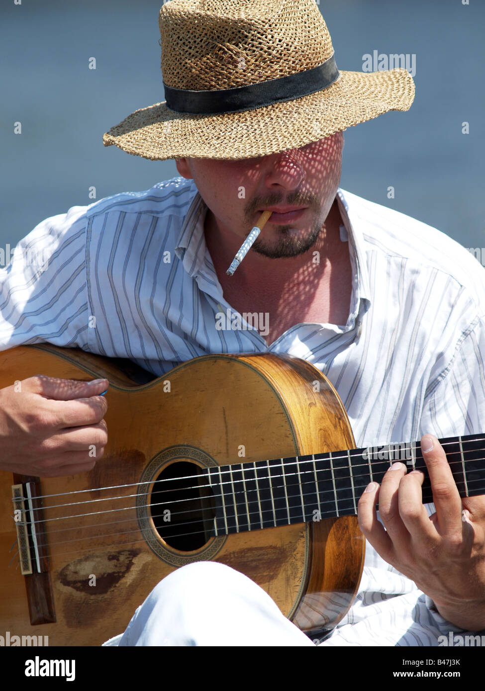 Playing guitar while smoking hi-res stock photography and images - Alamy