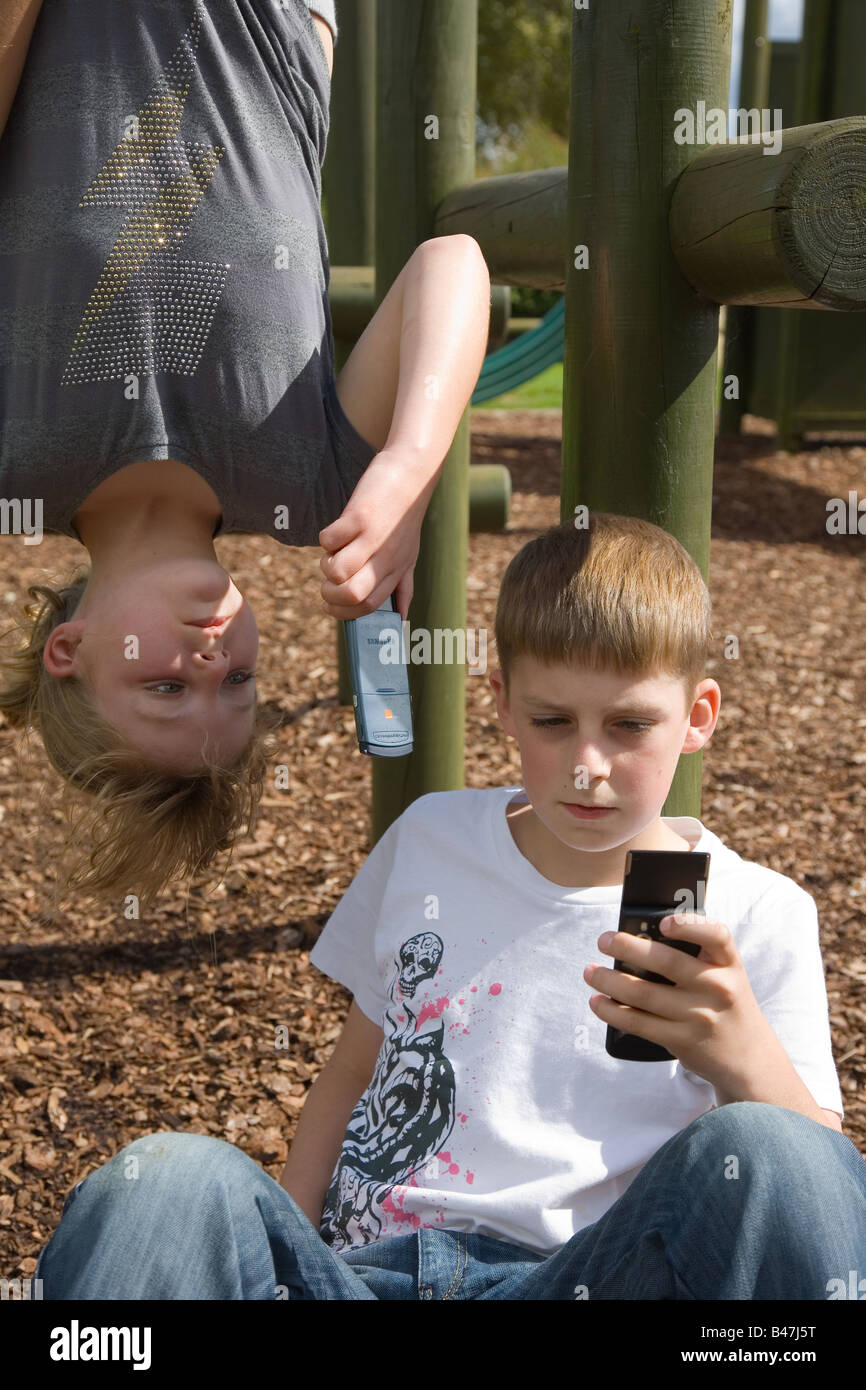 Youngsters using their mobile phones Stock Photo - Alamy