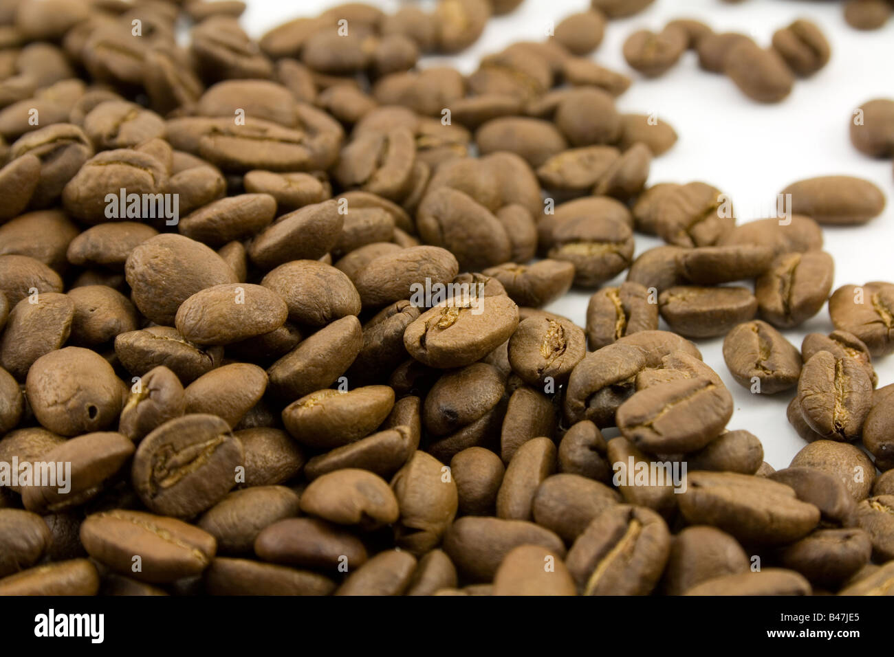 coffee beans isolated on white Stock Photo - Alamy