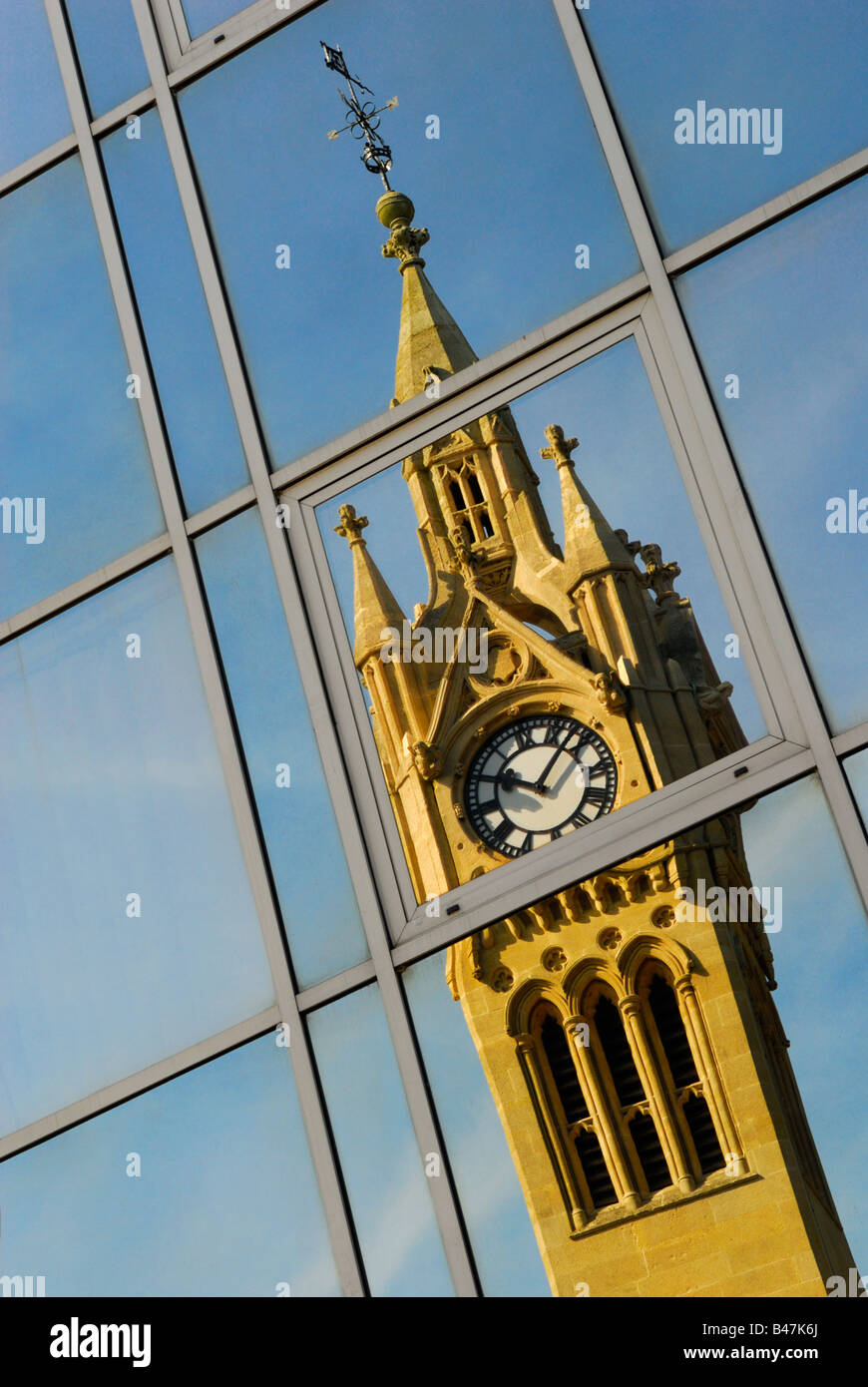 Reflection in modern office building of Coronation Clock tower ...