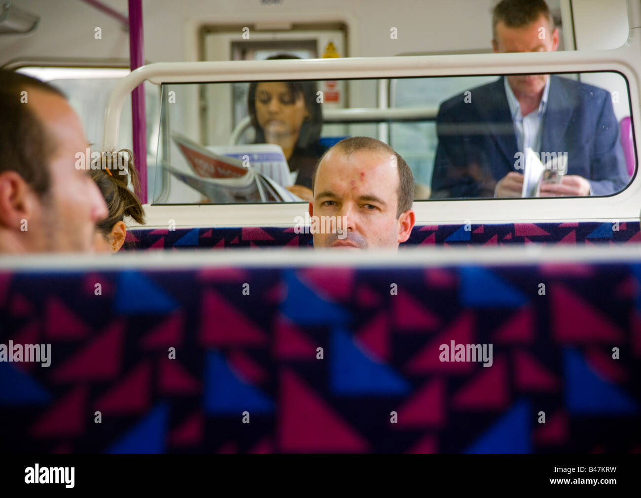 Commuters on the metropolitan line train London England UK Stock Photo ...