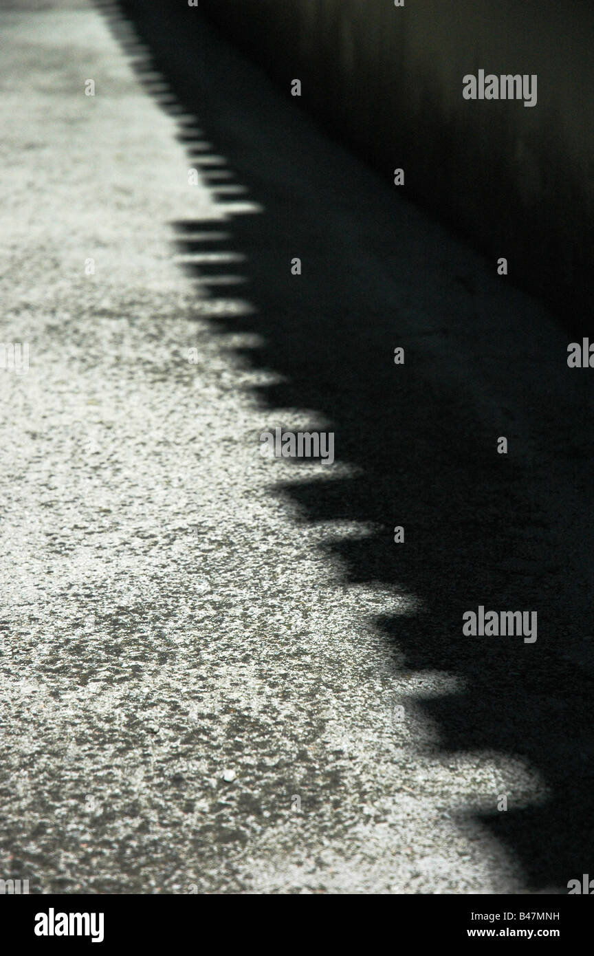 Shadow falling on a concrete floor Stock Photo - Alamy