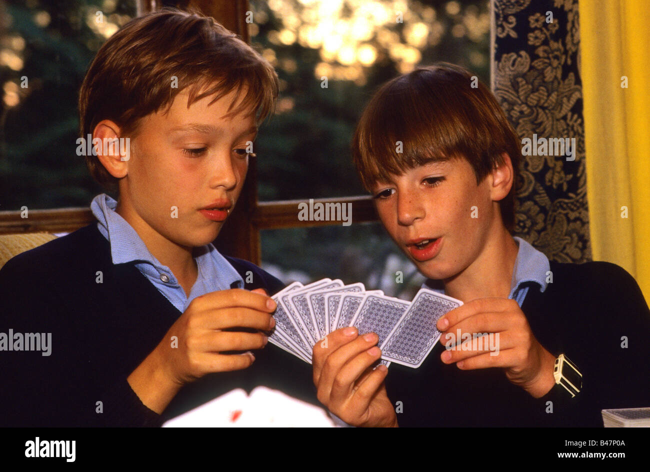 Two boys at Cothill School playing cards at the end of the school day ...