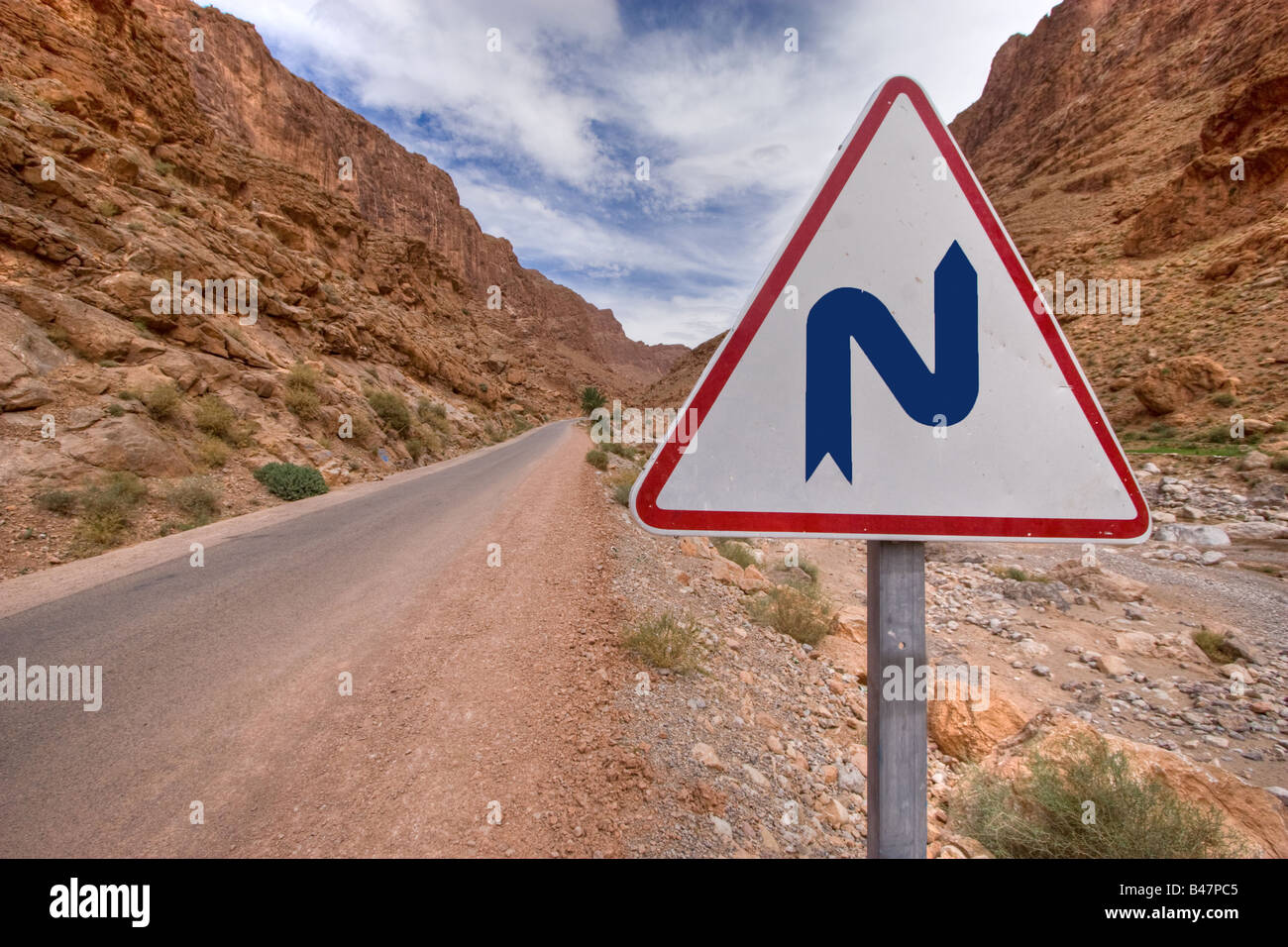 Double bend warning road sign hi-res stock photography and images - Alamy