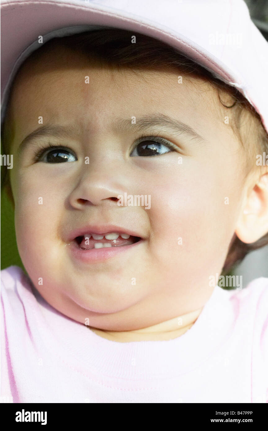 Portrait of little girl wearing a cap Stock Photo - Alamy