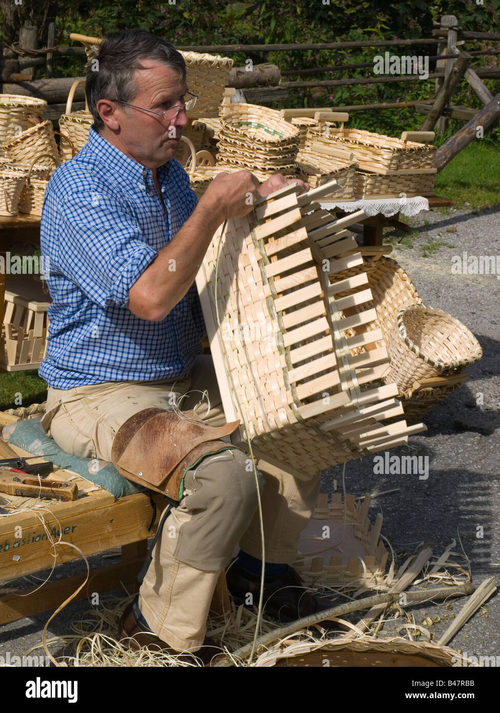 A basket maker demonstrating his craft at Niedreau Austria Stock Photo ...