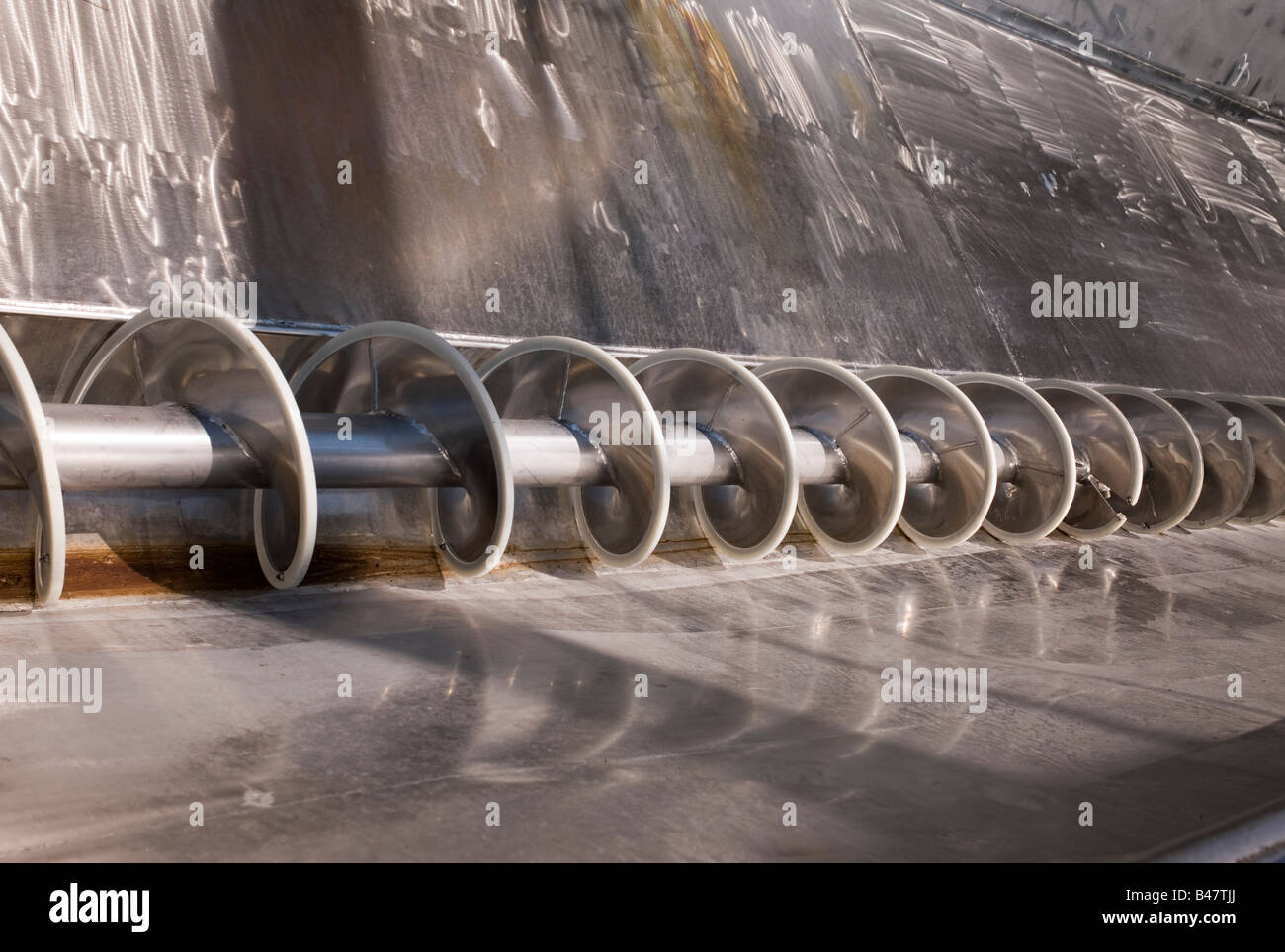 Slow rotating auger in a winery for moving grapes for further ...