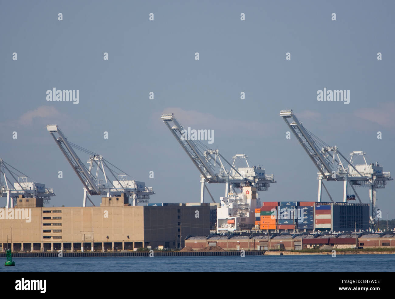 Cranes in a loading area Stock Photo - Alamy
