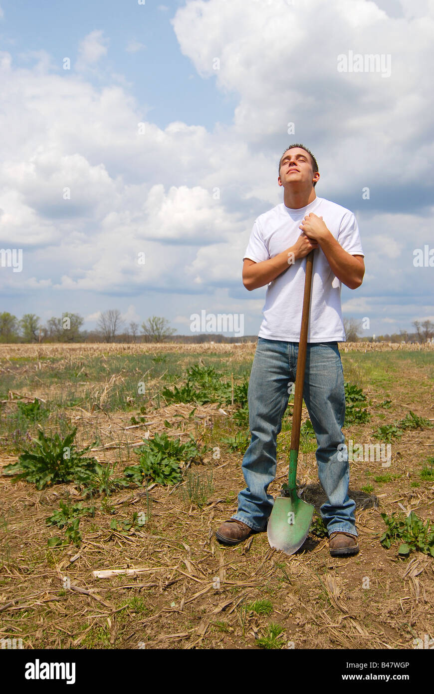 Man with a shovel Stock Photo - Alamy
