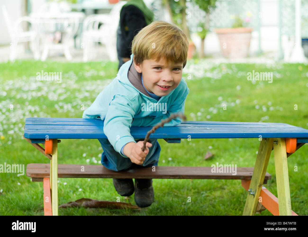boys with funny face in a table Stock Photo - Alamy